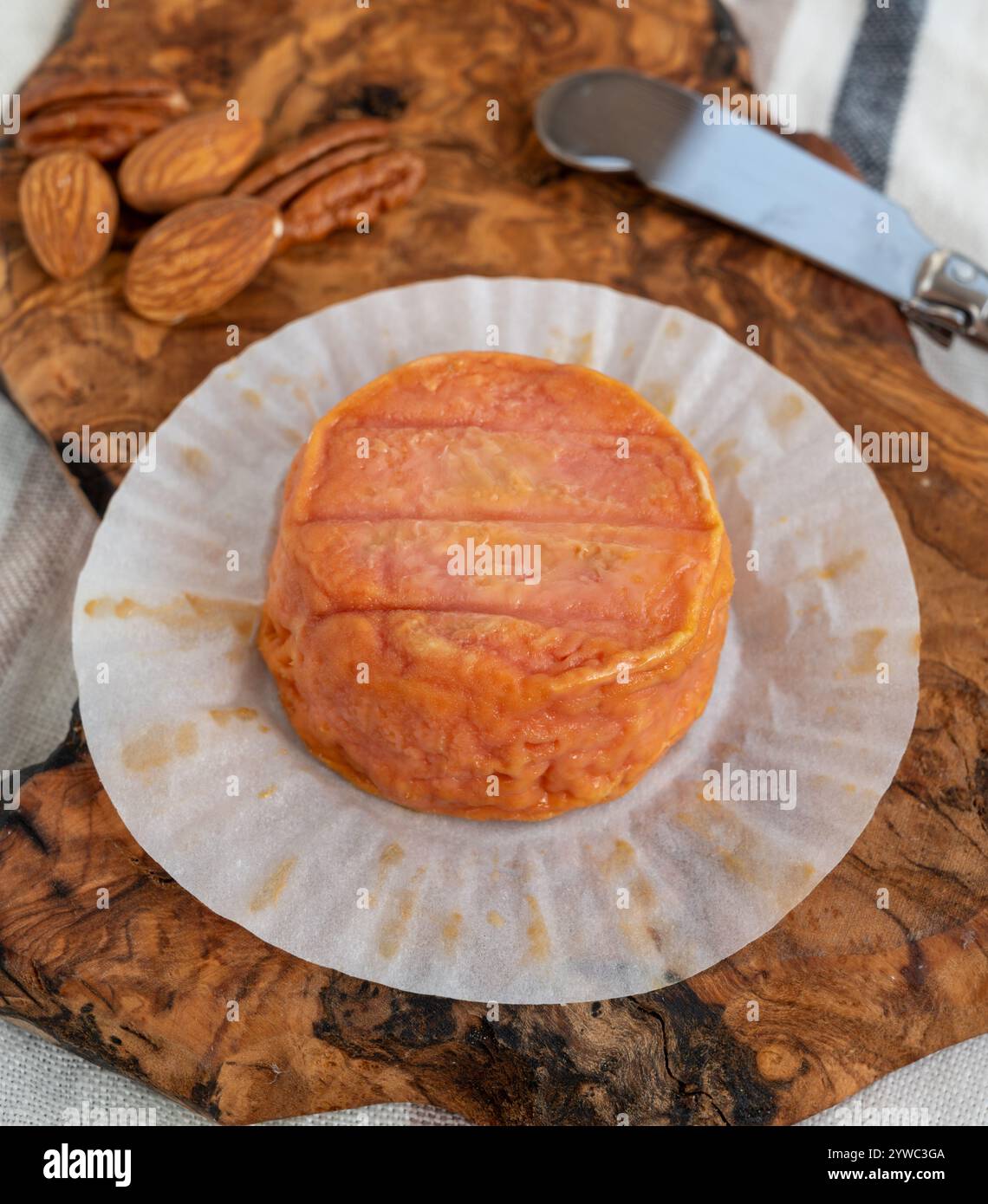Rond des Vignes washed-rind cheese with ivory-orange rind, strong nose ...