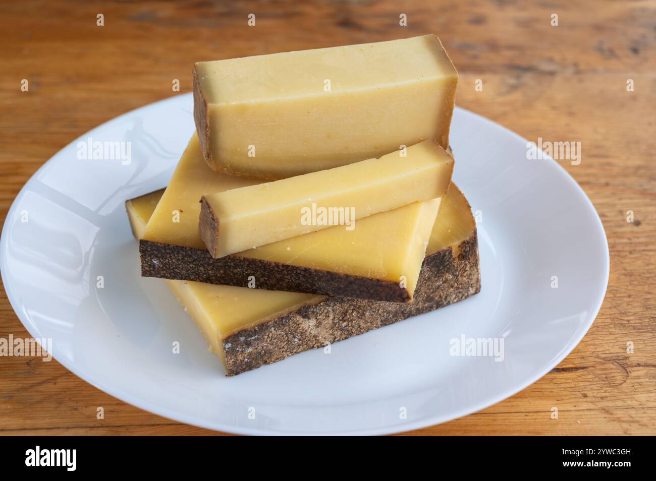 French aged in caves cheese Comte with brown rind, made from ...