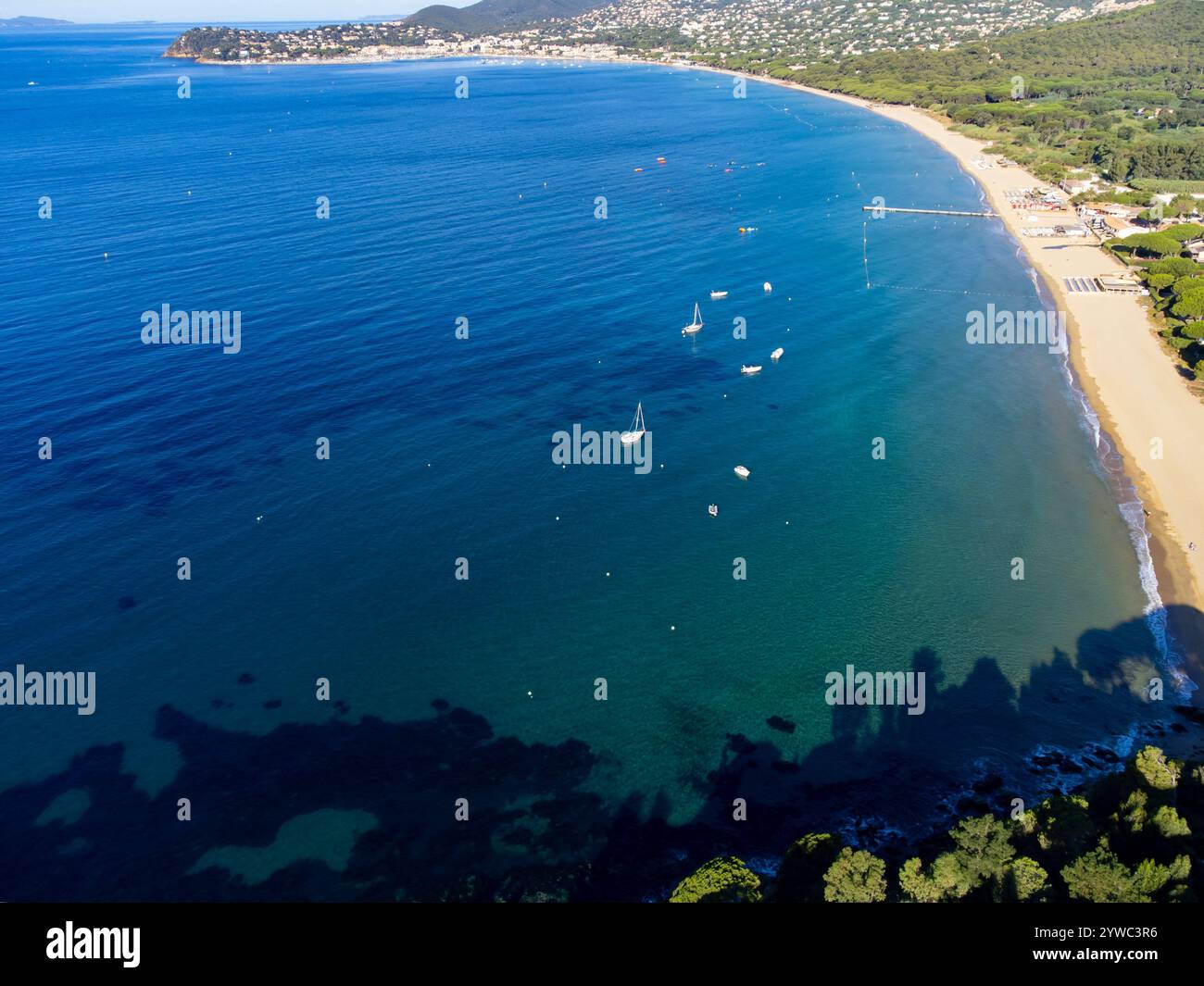 Aerial view on boats, crystal clear blue water of Plage du Debarquement ...