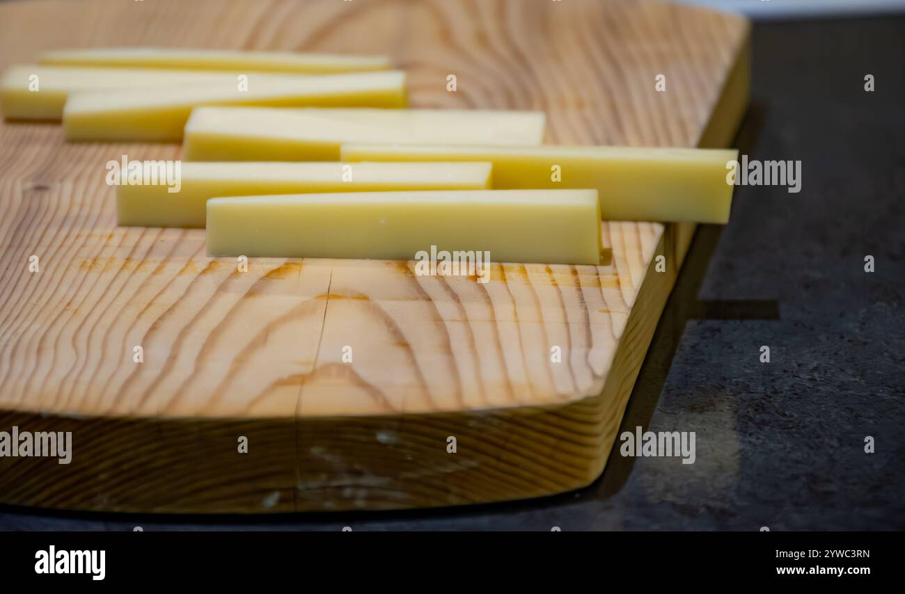 Cheese tasting in aging rooms with many shelves in caves, central ...