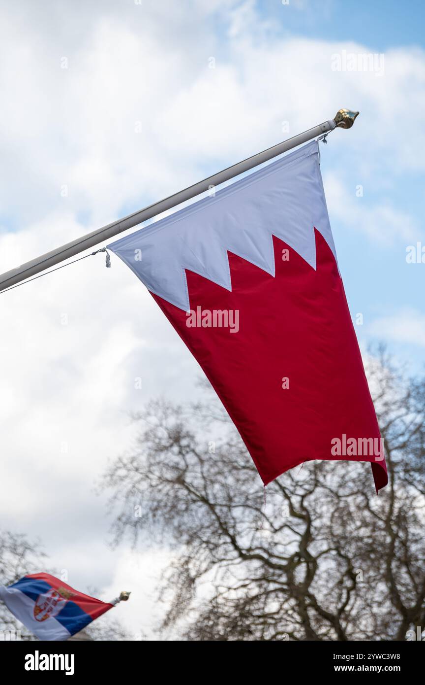 Red white National flag of Bahrain, Kingdom of Bahrain, island country ...