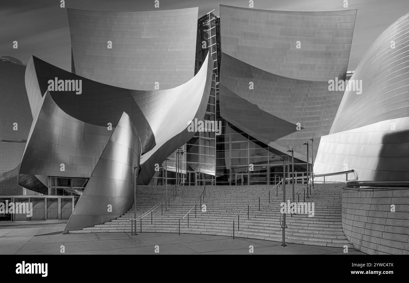 The image shows a modern, curved steel structure with a focus on its ...