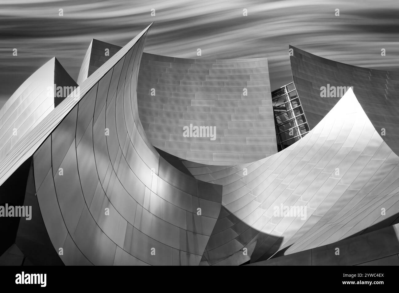 Dynamic and sculptural metal facade of a modern building juxtaposes ...