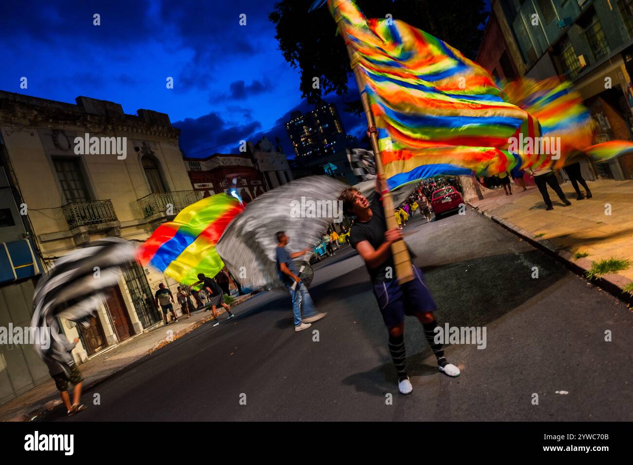 Flag bearers (the Portabanderas) wave giant flags as they perform ...