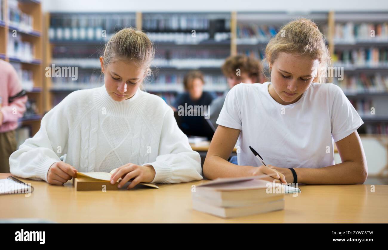 Concentrated girl doing school homework hi-res stock photography and ...