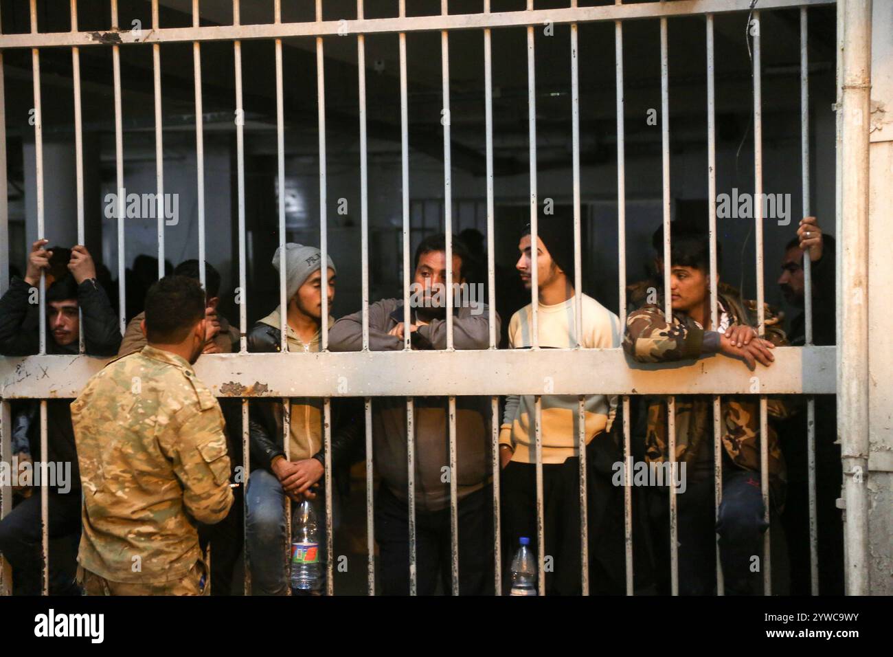 People gather at the Saydnaya prison in Damascus looking for loved ones ...