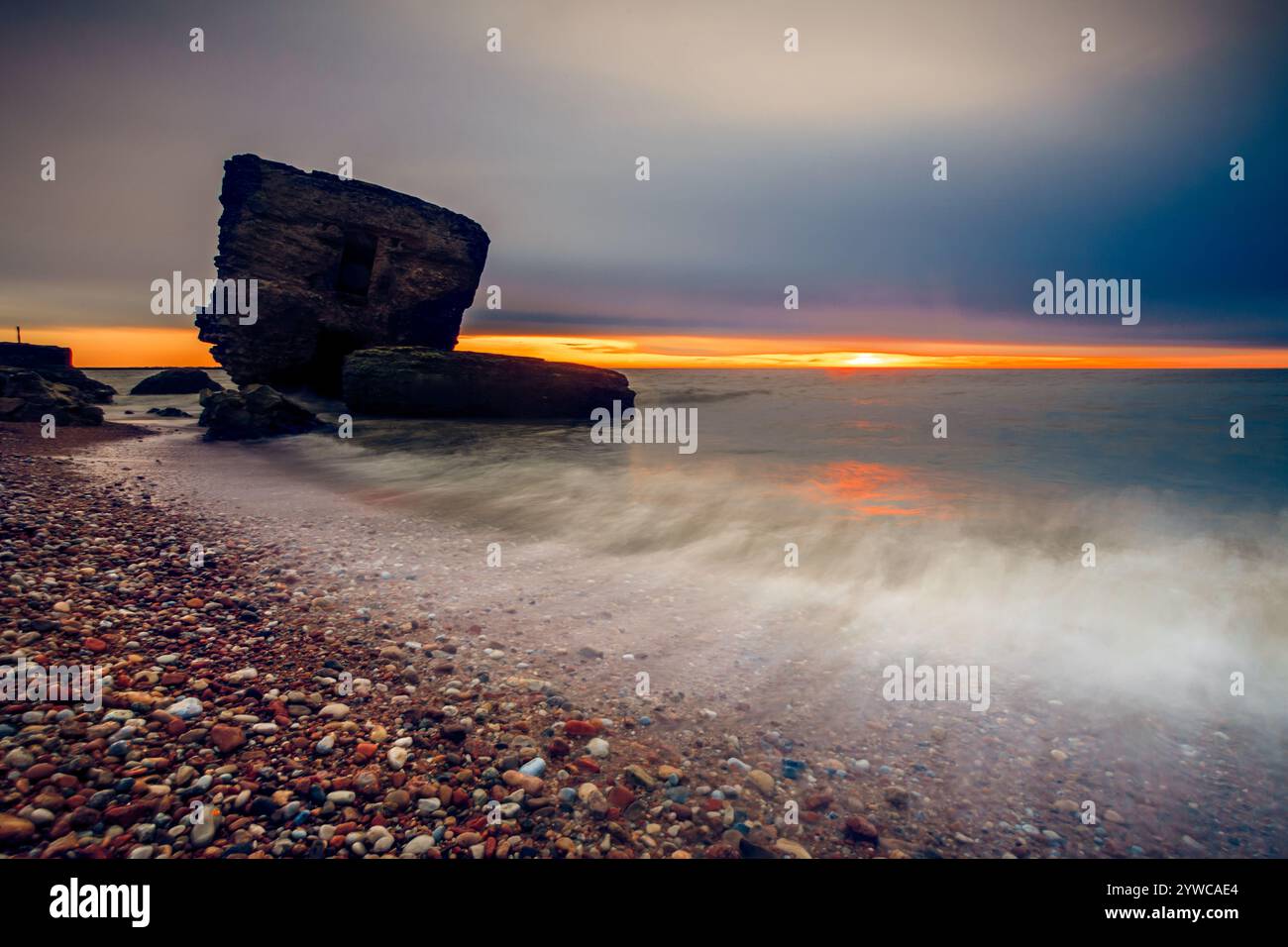 Silhouette of an old bunker on a pebble beach, Karosta, Liepaja, Latvia ...