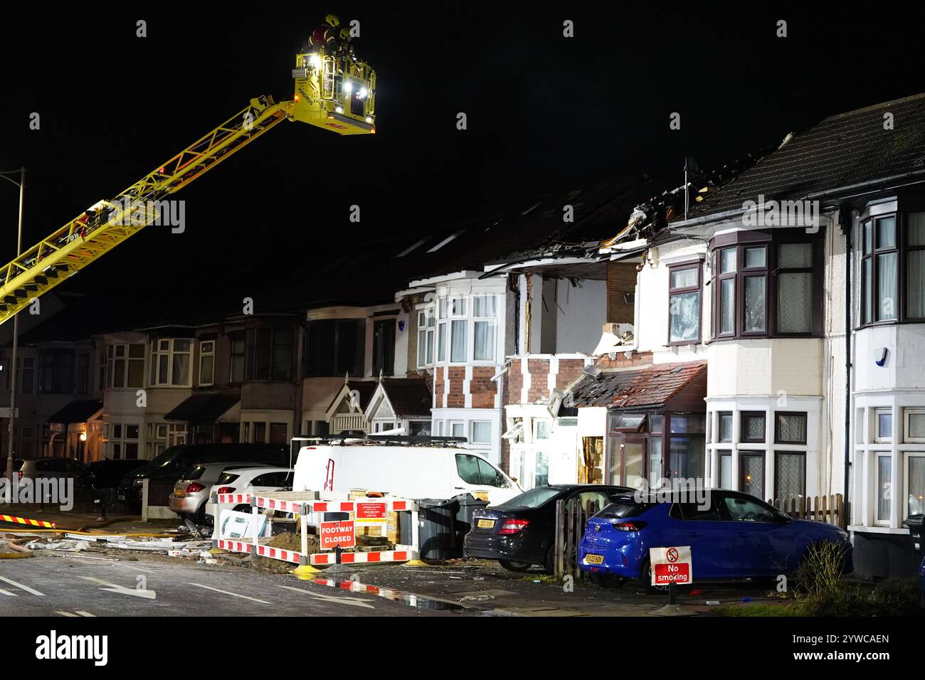 Firefighters at the scene on Ley Street, Ilford, after two people were ...