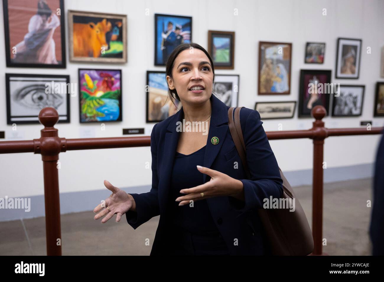 Rep. Alexandria Ocasio-Cortez (D-N.Y.) speaks with a reporter as she ...
