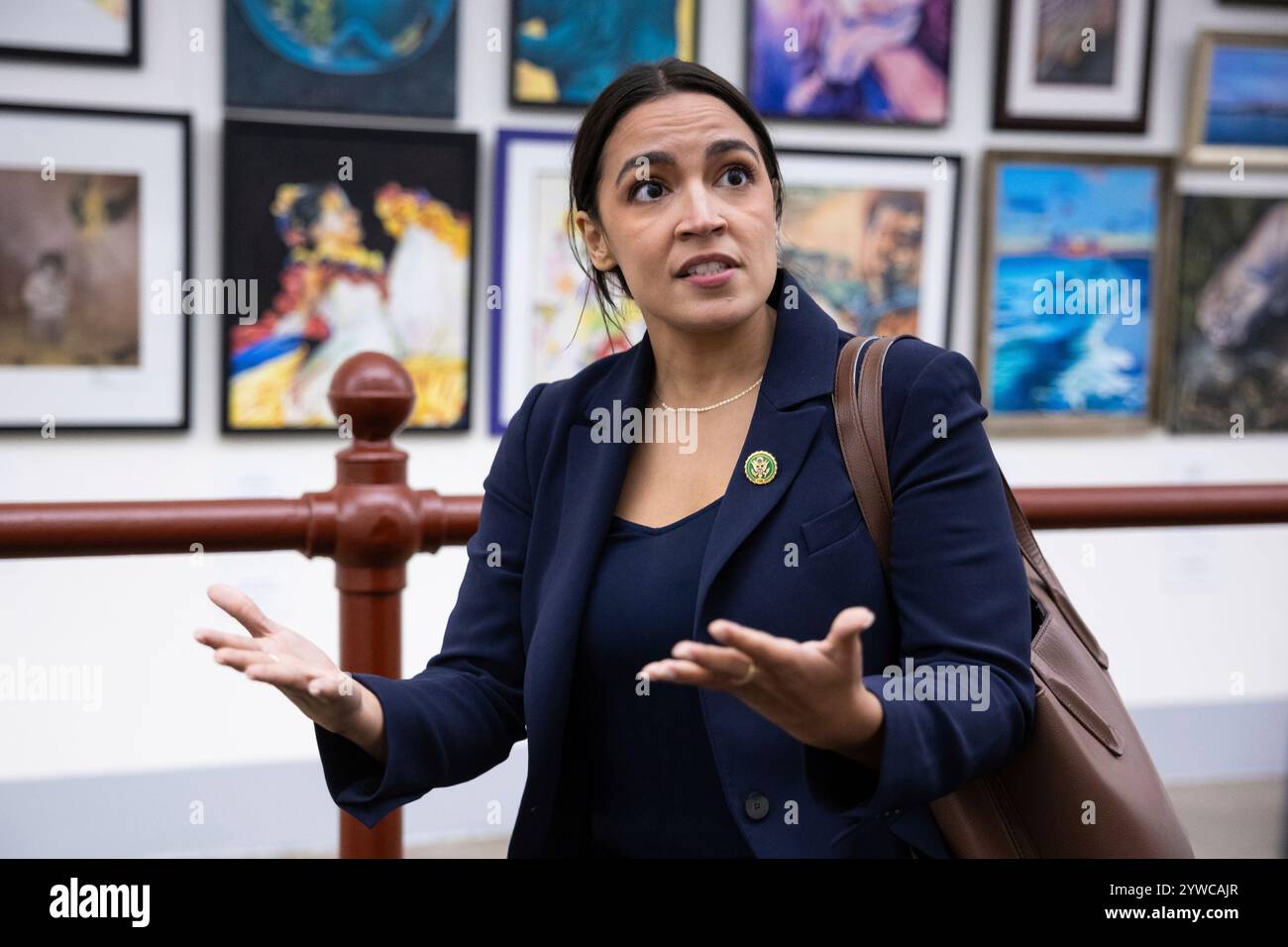 Rep. Alexandria Ocasio-Cortez (D-N.Y.) speaks with a reporter as she ...