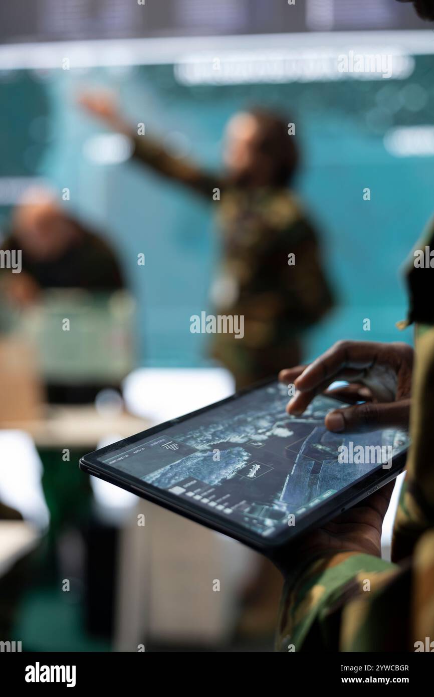 Army staff monitoring infantry unit on ongoing operation using his ...