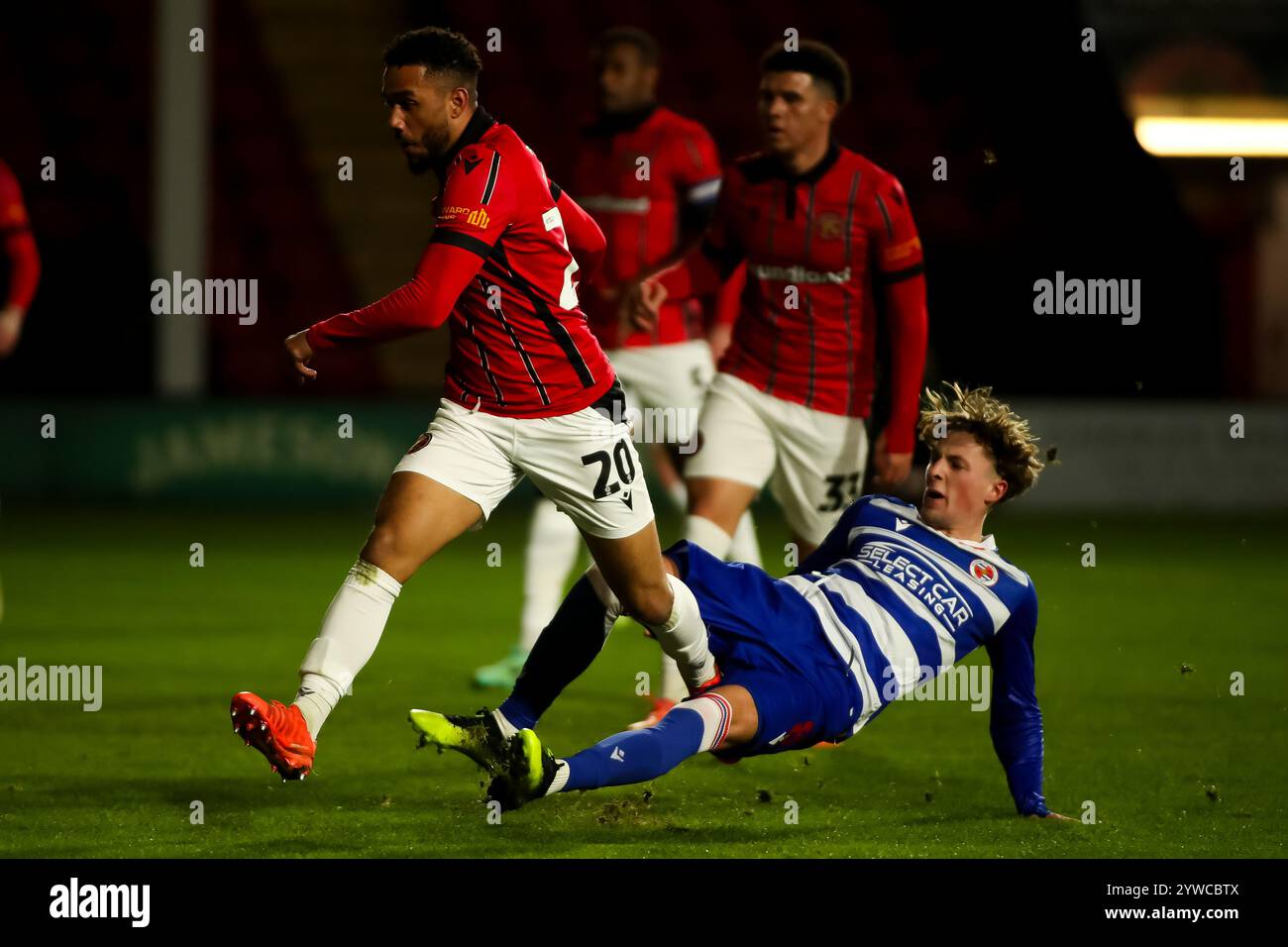 Charlie Savage of Reading tackles George Hall of Walsall during the EFL ...