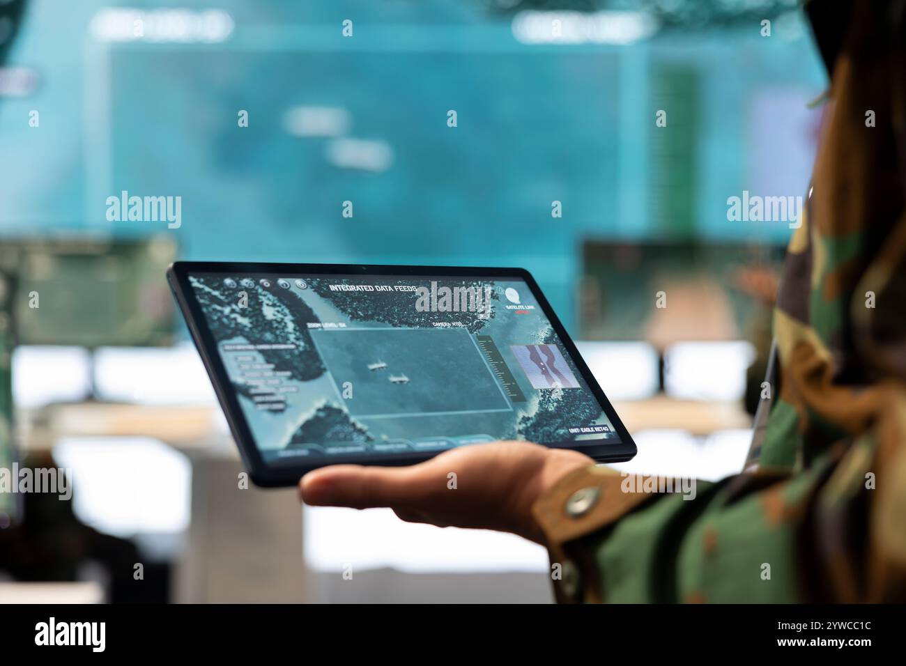 Navy operations engineer following enemy warship trajectory on CCTV ...