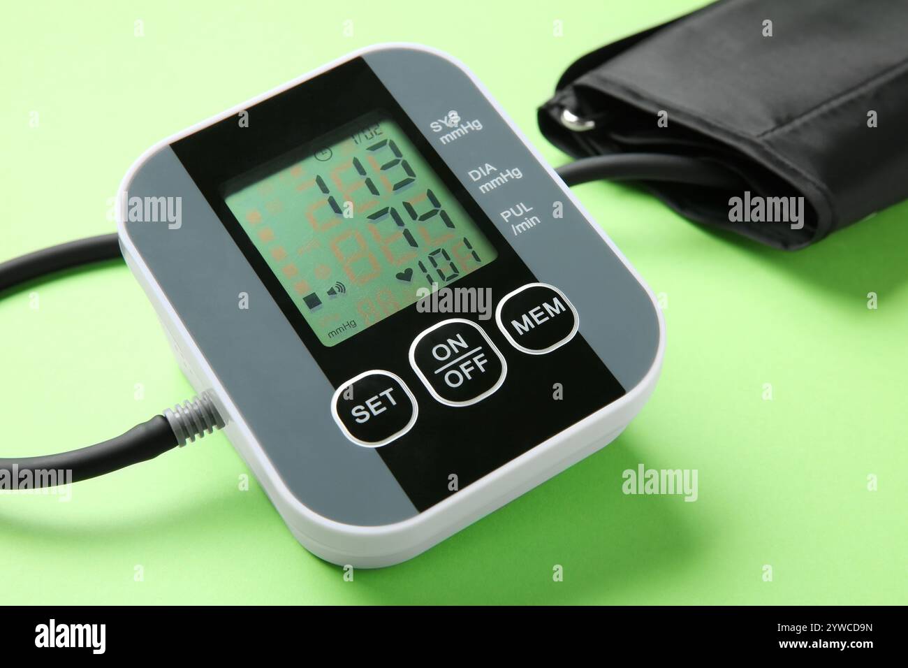 Blood pressure measuring device on green background, closeup Stock ...