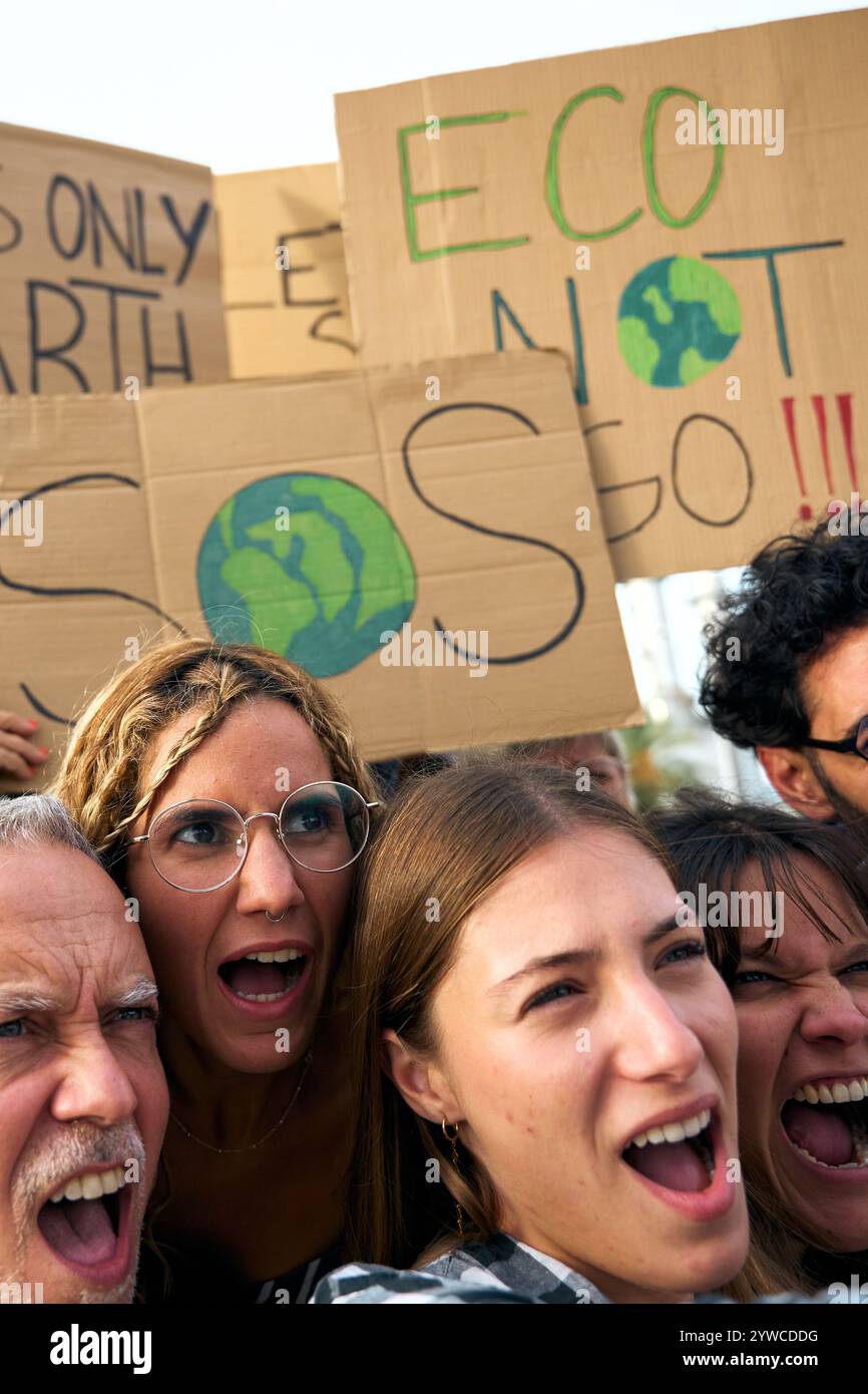 Vertical. Cardboard banners written against climate Stock Photo - Alamy
