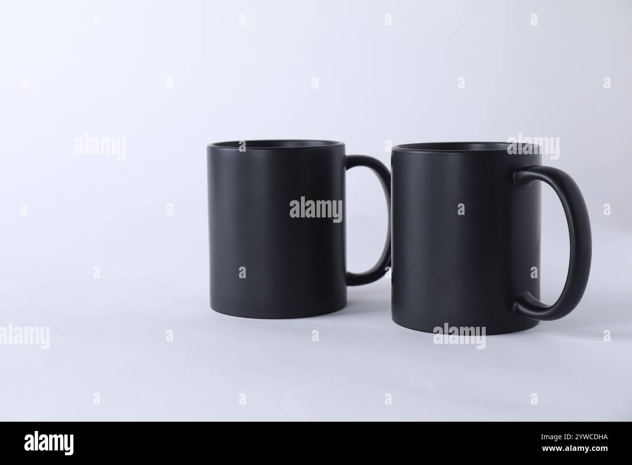 Two blank black mugs on white background. Mockup for design Stock Photo ...