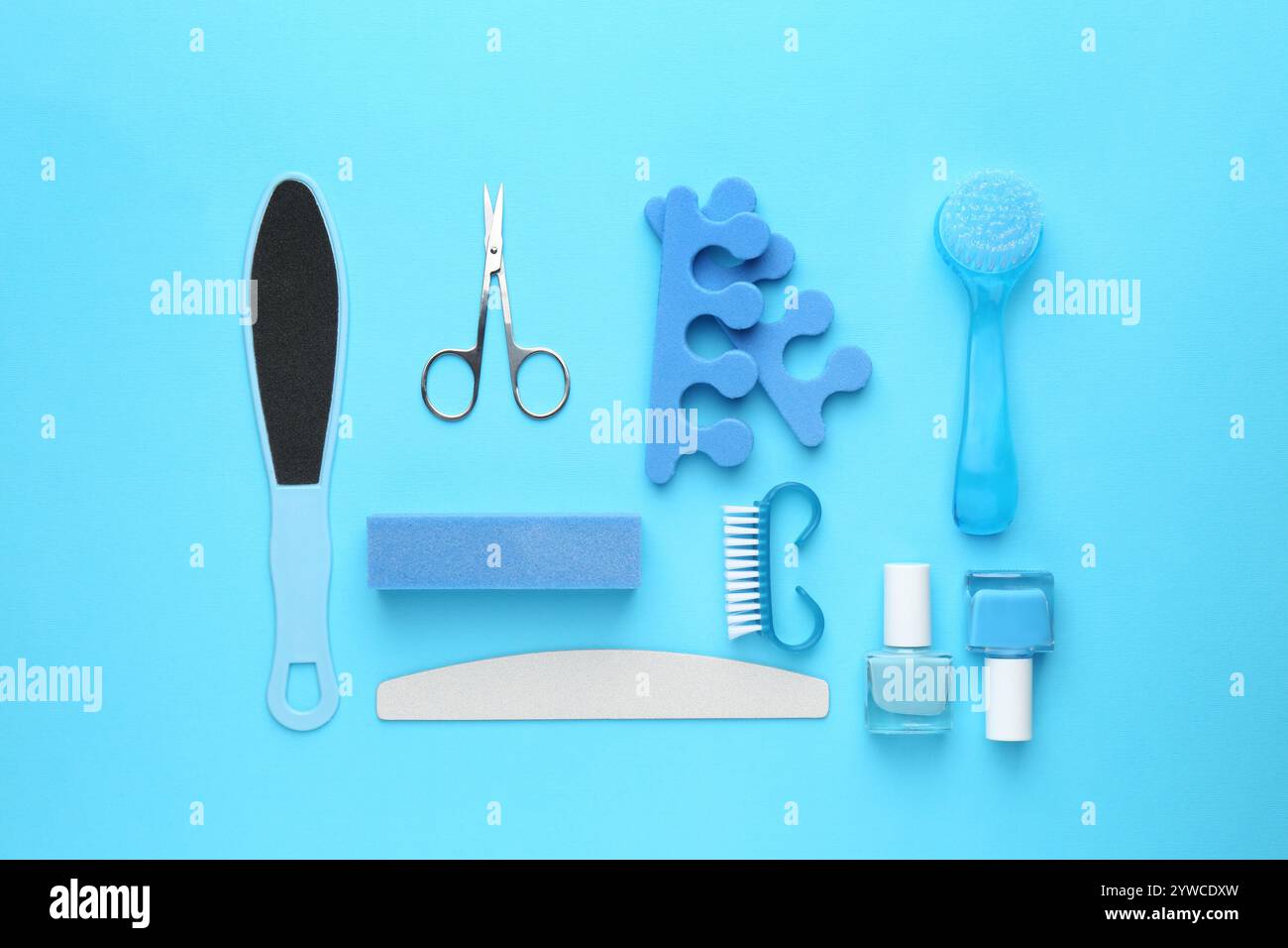 Set of pedicure tools on light blue background, flat lay Stock Photo ...