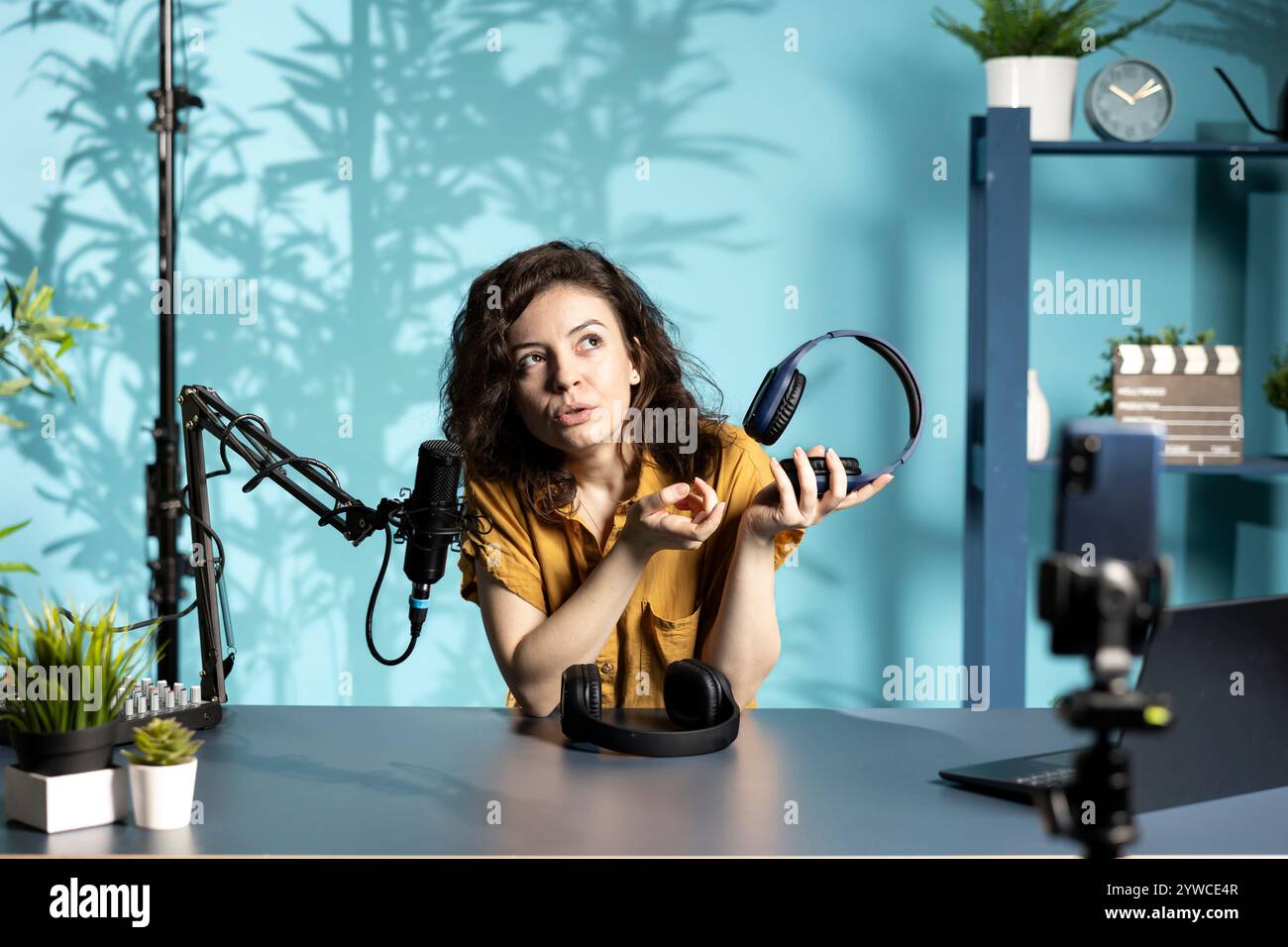 Audiophile reviewing newly launched wireless headphones, testing sound ...