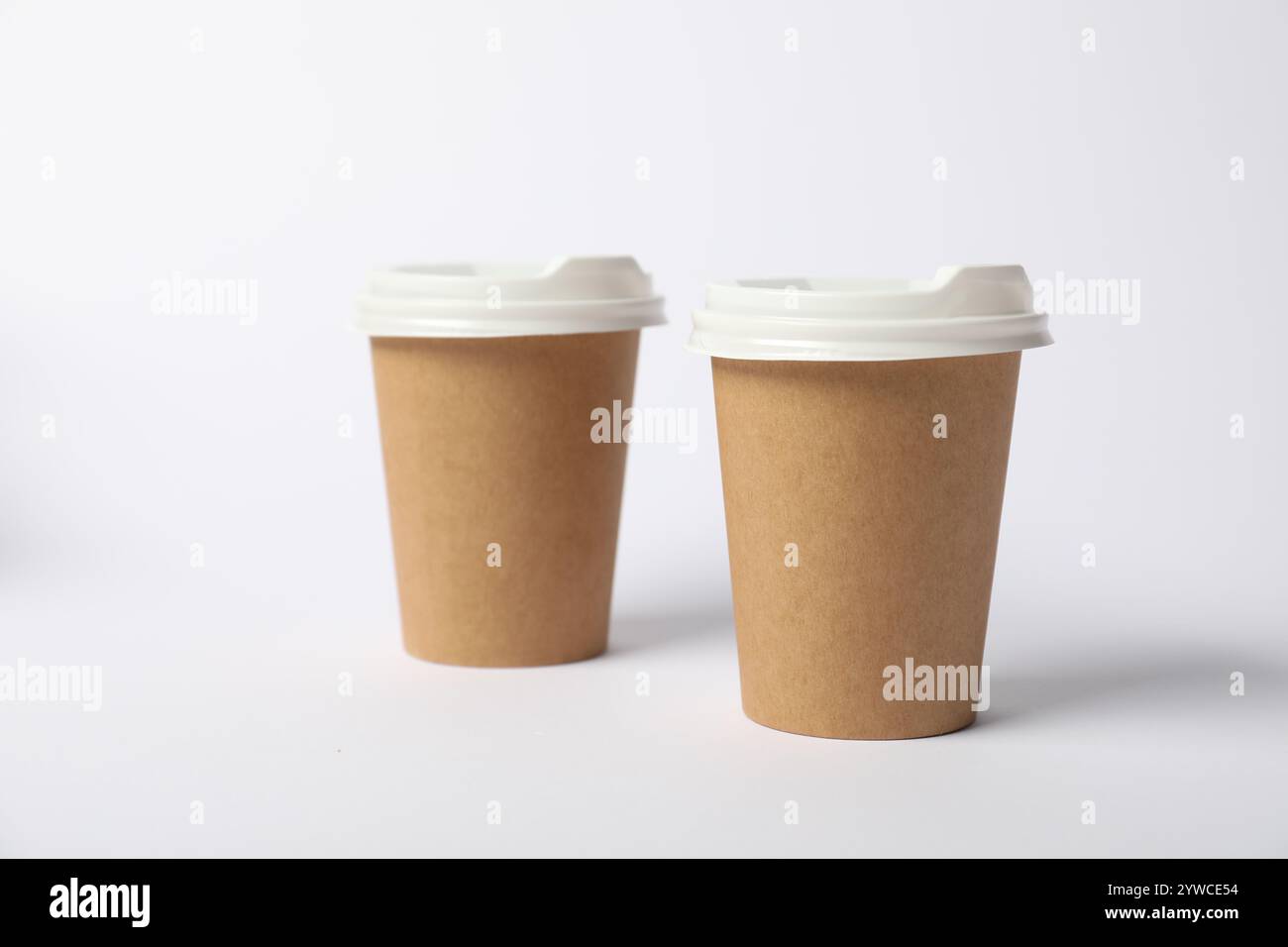 Paper cups on white background. Mockup for design Stock Photo - Alamy