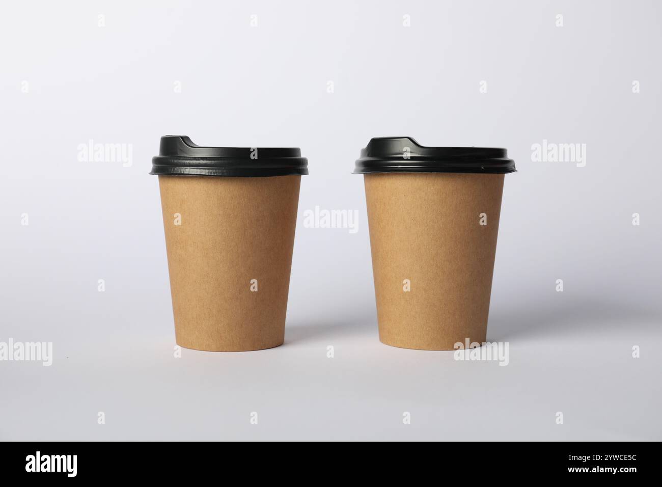 Paper cups on white background. Mockup for design Stock Photo - Alamy