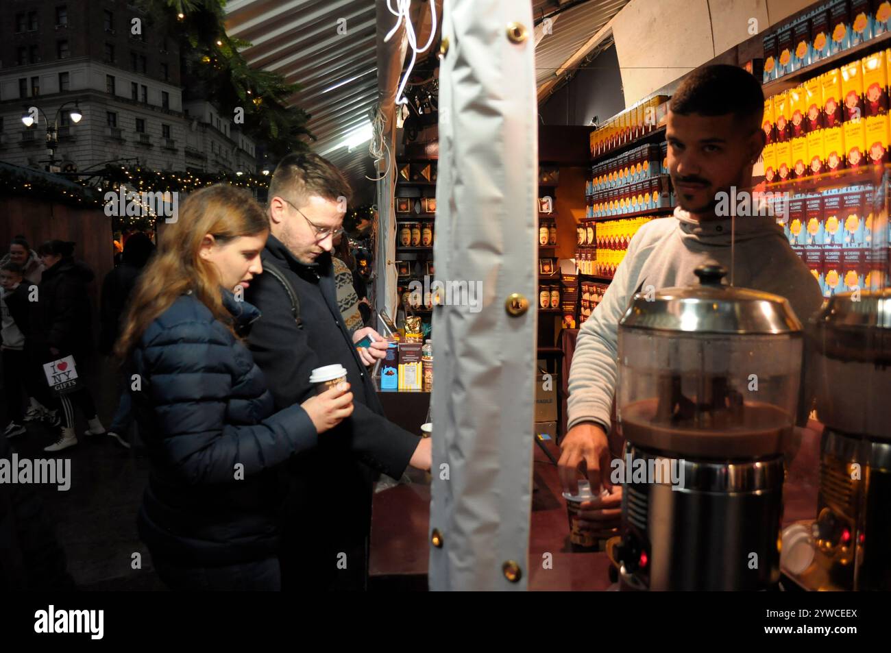 People are seen at a pop-up holiday market called Herald Holiday Market ...
