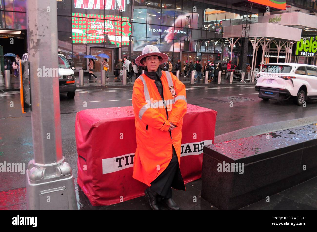 A security guard is seen in a rainstorm in Times Square, Manhattan, New ...