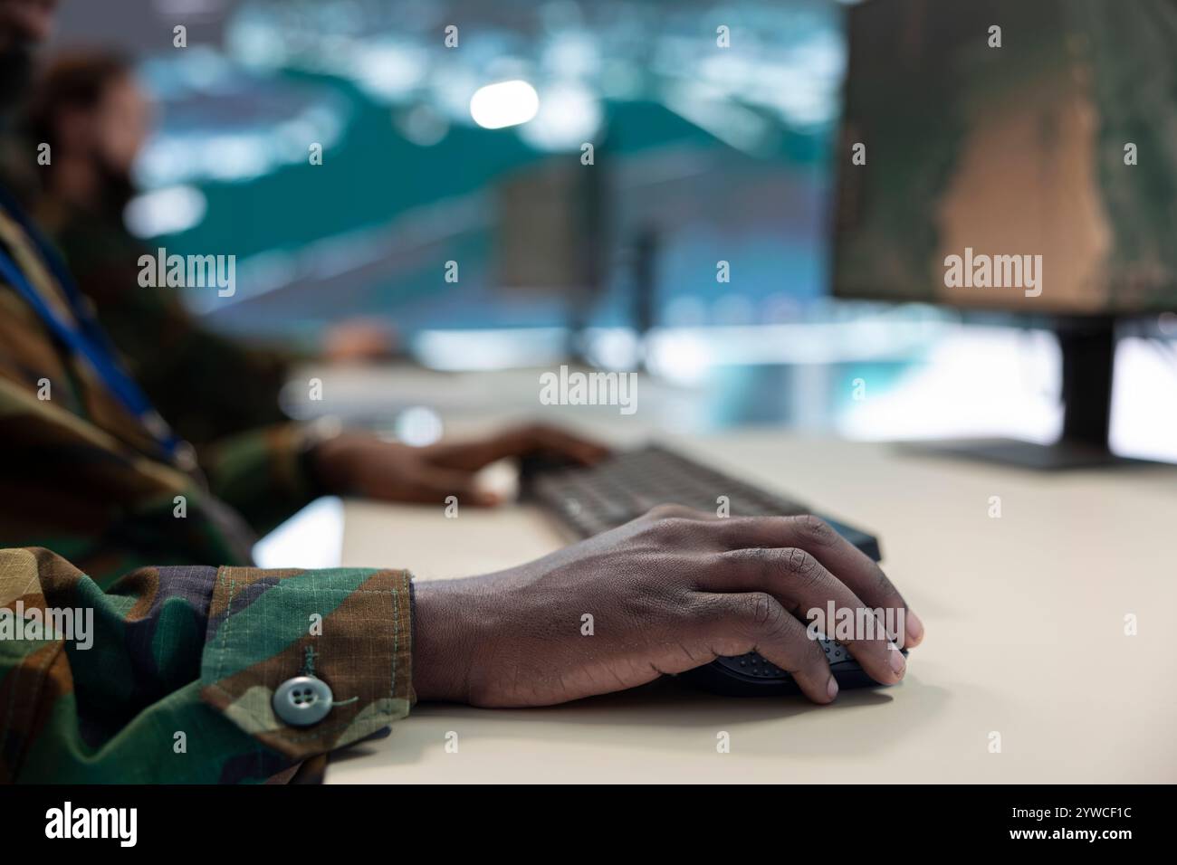 Reconnaissance specialist examines satellite CCTV footage to gather ...