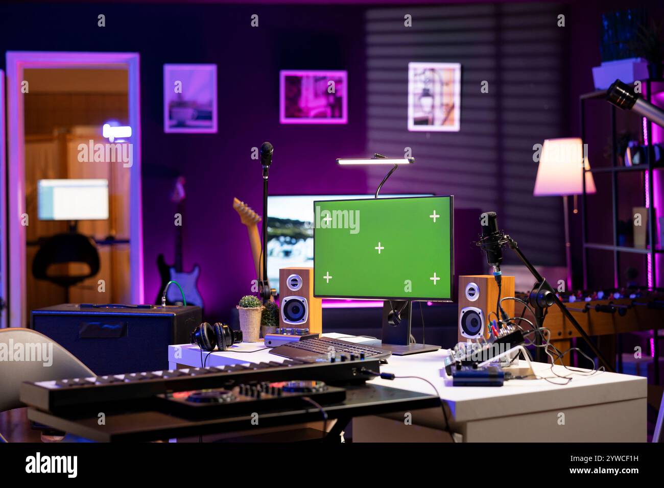 Empty home studio with computer running greenscreen display, audio ...