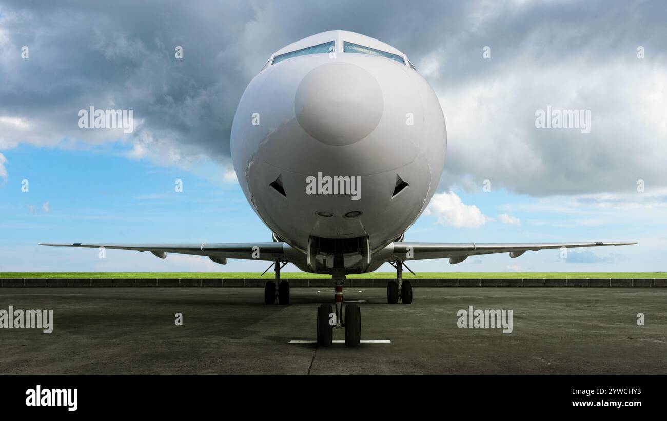Commercial airplane on the runway with a blue sky background. Travel by ...