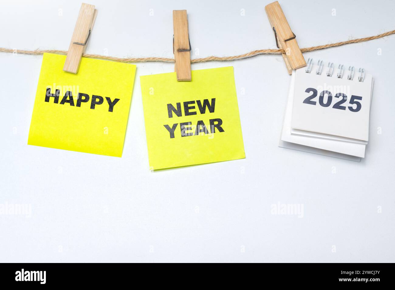 Top view of 2025 number and text Happy New Year written on the paper ...
