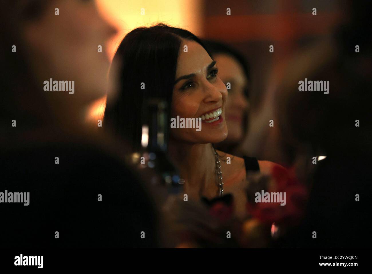 Actor Demi Moore smiles as Connie Nielsen presents her the Maria ...