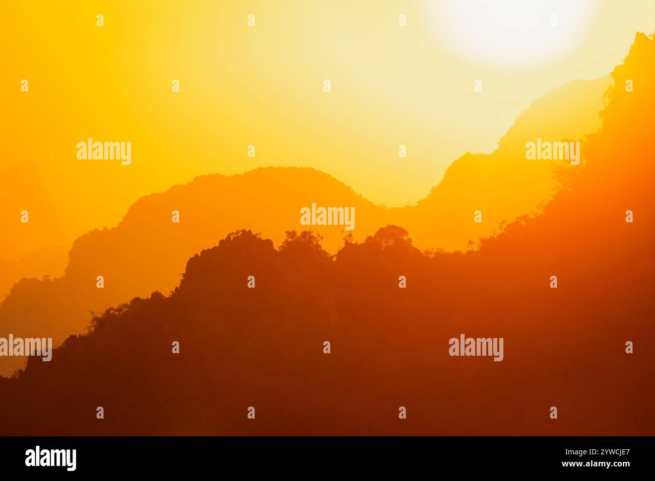 The silhouettes of the different mountains become fainter and dimmer ...