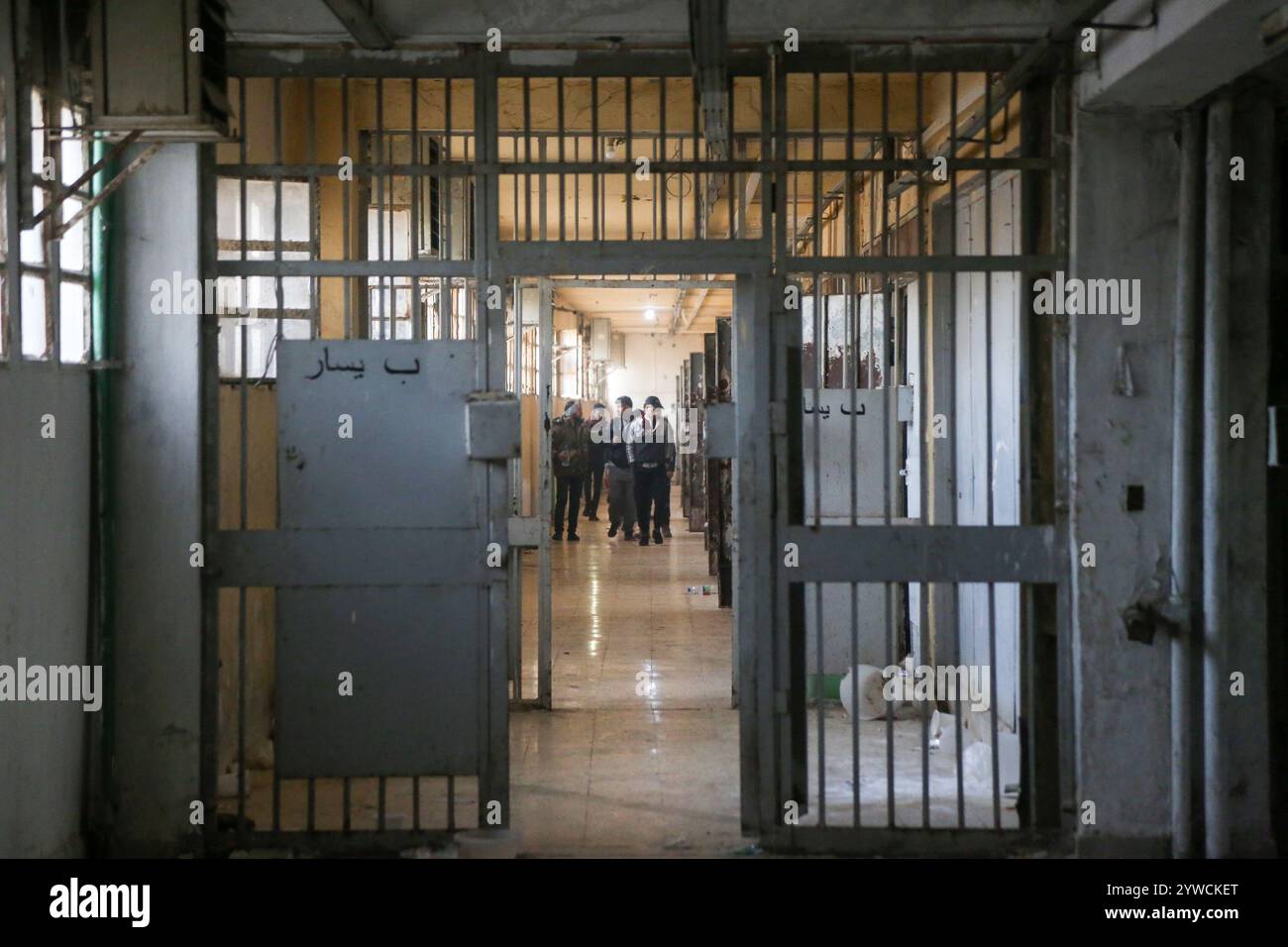 People gather at the Saydnaya prison in Damascus looking for loved ones ...