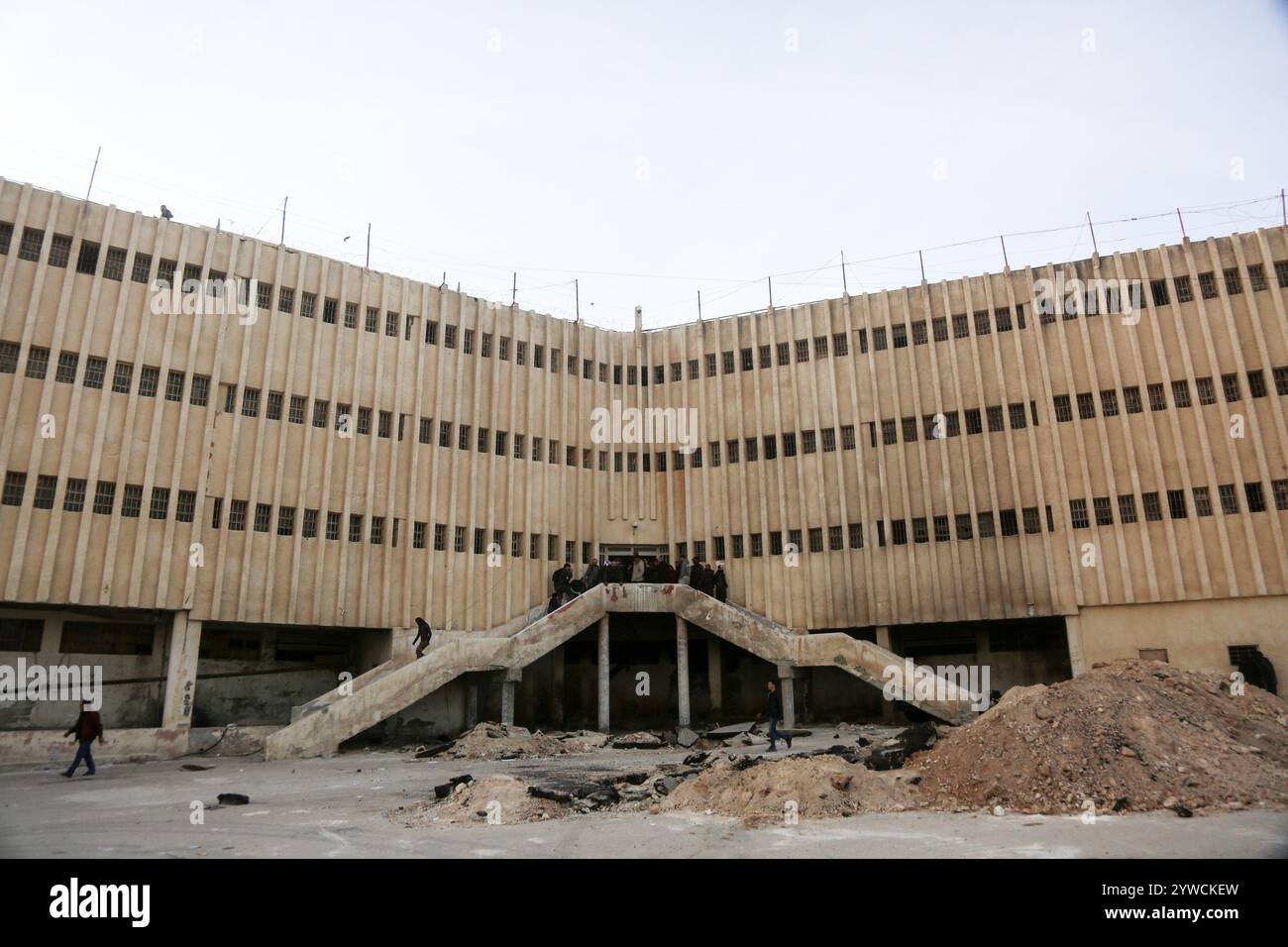 People gather at the Saydnaya prison in Damascus looking for loved ones ...