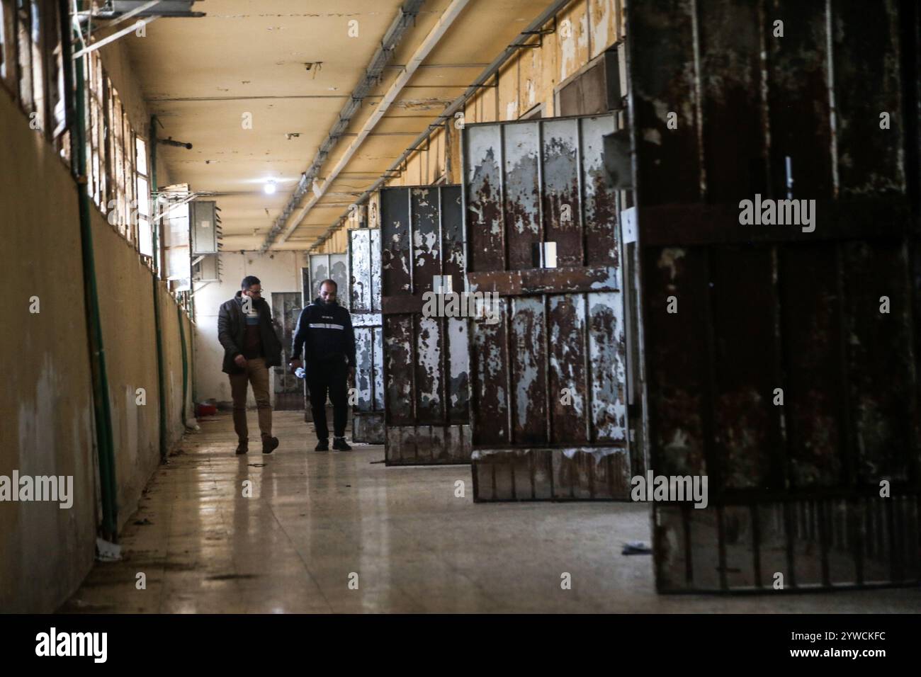 Teams carry out investigation in secret compartments at Sednaya Prison ...