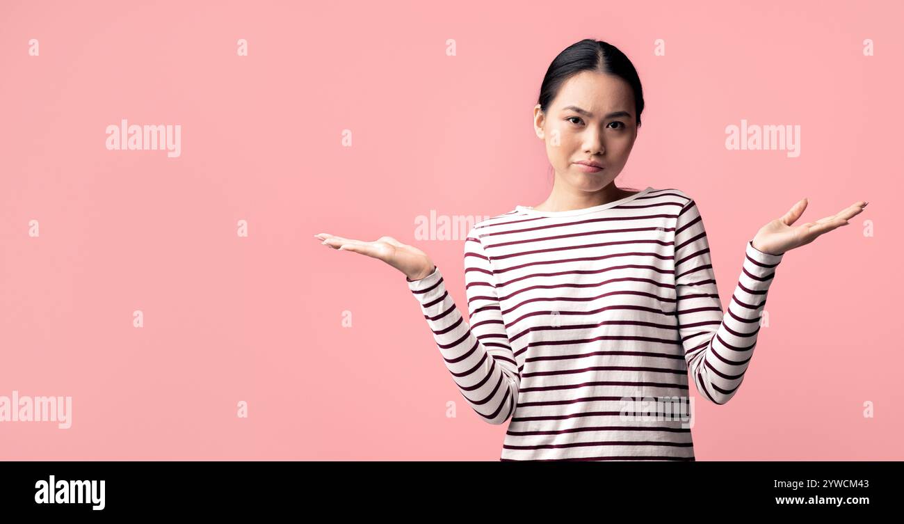 Difficult Choice. Doubtful Young Asian Woman Shrugging Shoulders And ...