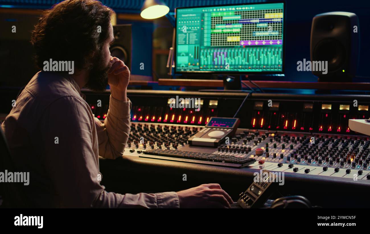 Sound Designer Processing And Mixing Tunes In Control Room Working On