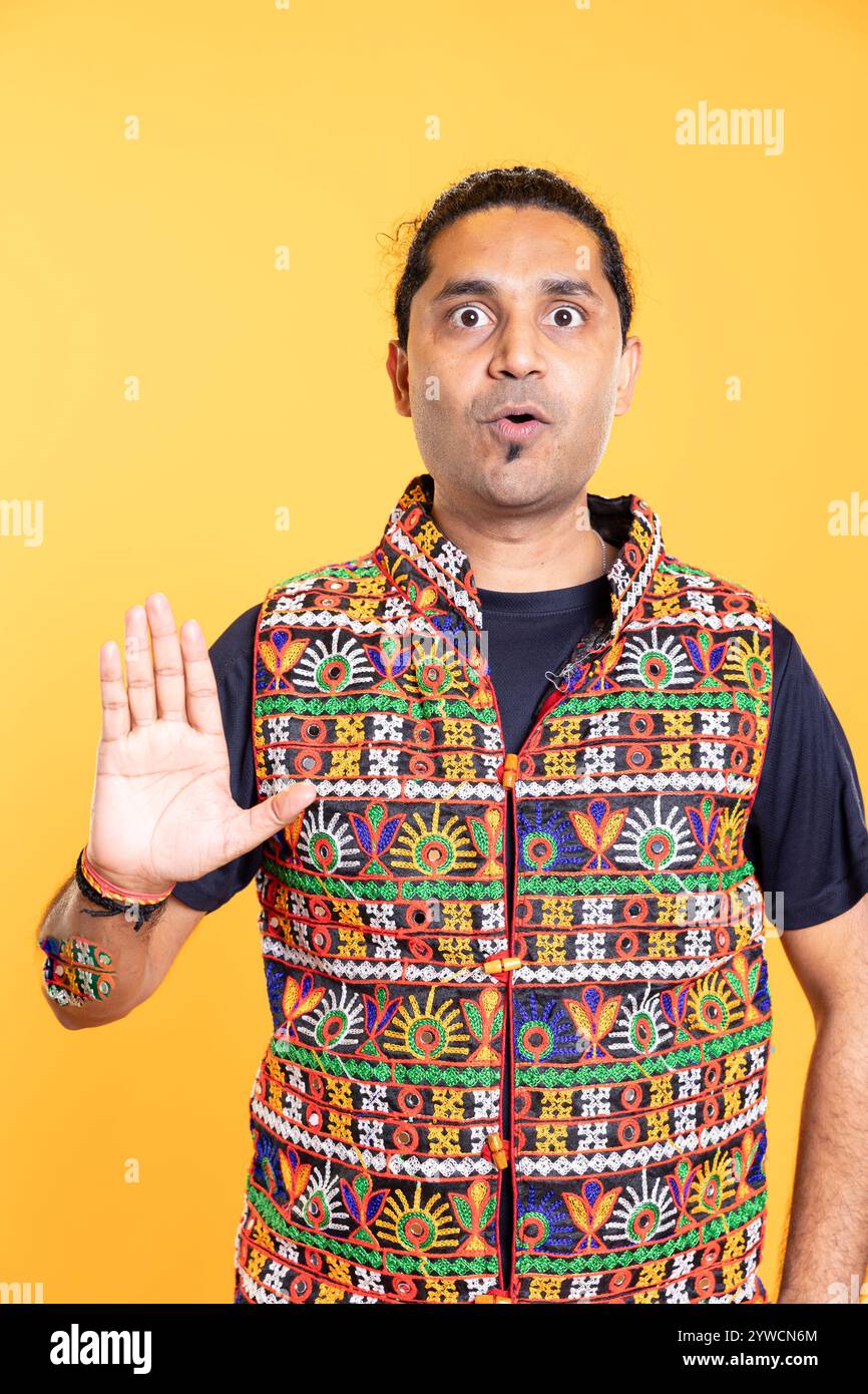 Man trying to stop chaotic fight using calming hand gesture to diffuse ...