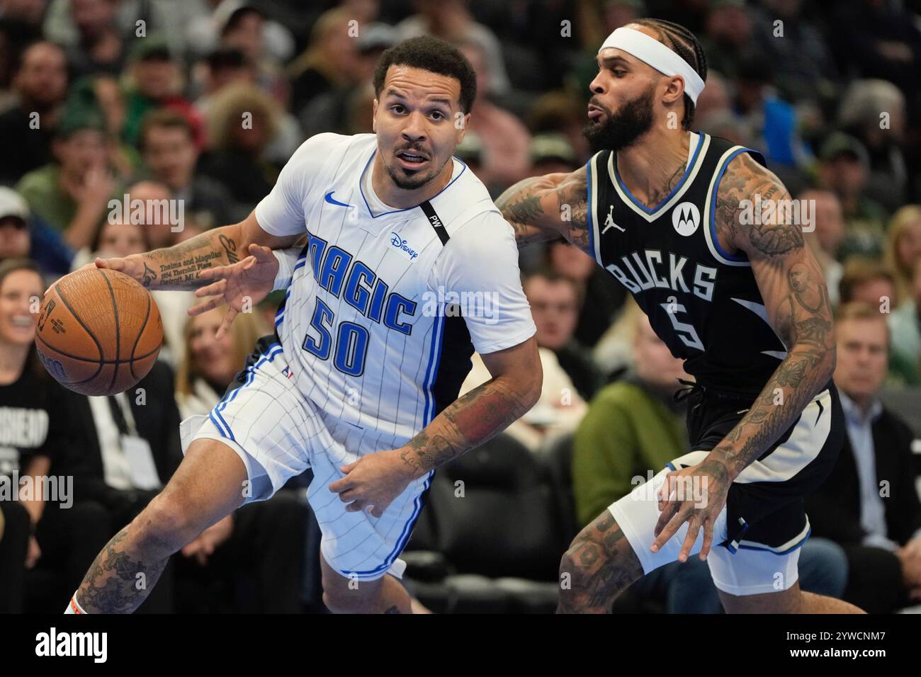 Orlando Magic's Cole Anthony drives past Milwaukee Bucks' Gary Trent Jr ...