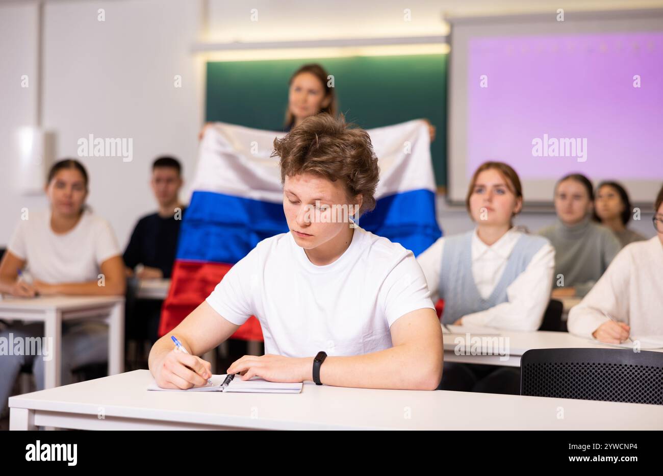 Female teacher tells her classmates about the country of Russian ...