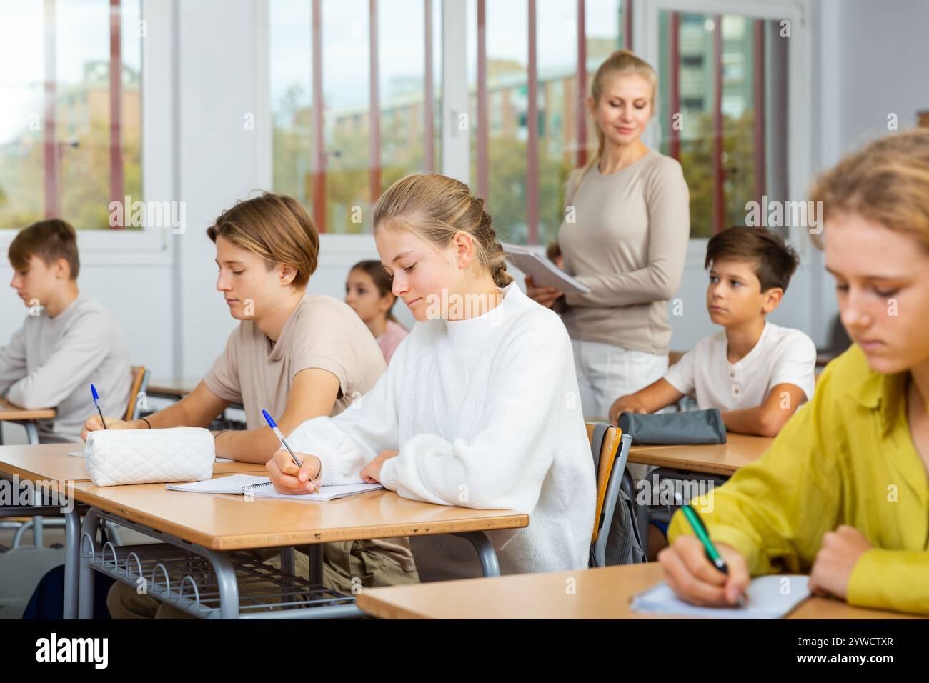 Student is sitting test and answer about task in classroom Stock Photo ...