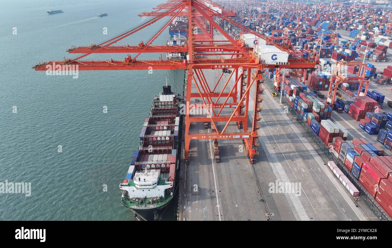 Large cargo ships are loaded at Qinzhou Automated Container Terminal in ...