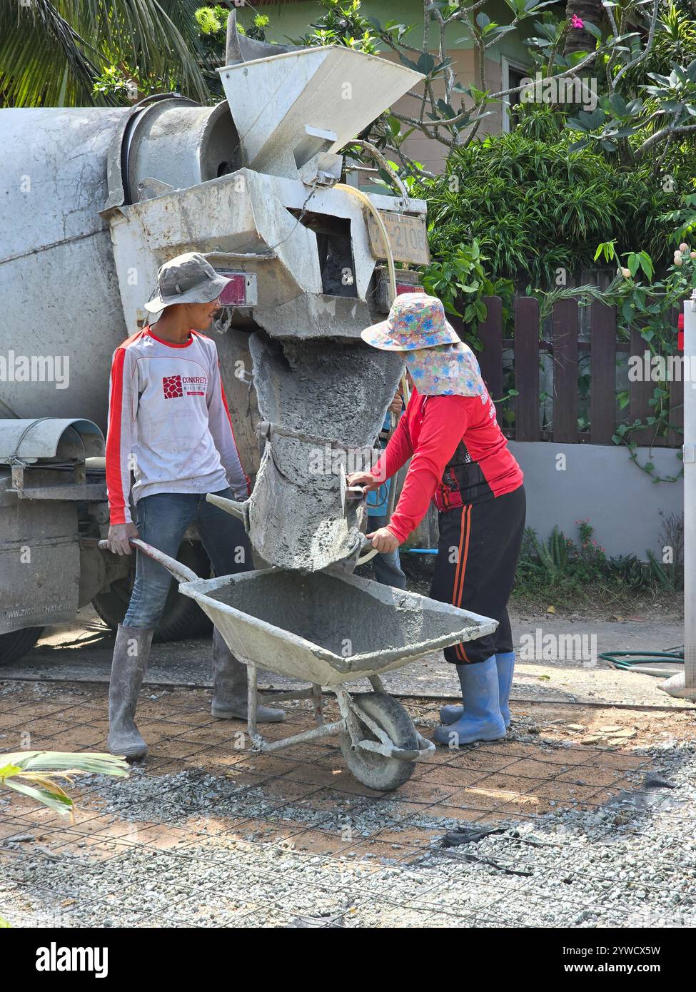Pattaya, Thailand November 29, 2024, Two skilled workers collaborate on ...