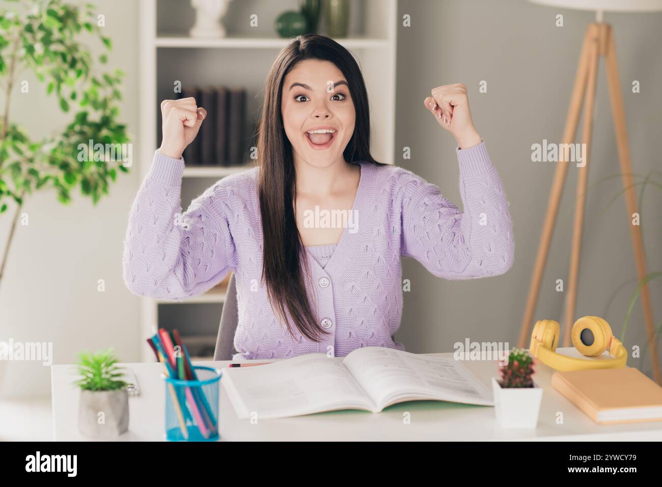 Photo of nice young teen girl winning do homework wear violet clothes ...