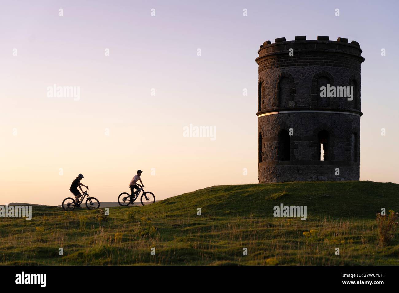 Mountain bikers at Solomon’s Temple, hilltop landmark, Buxton ...