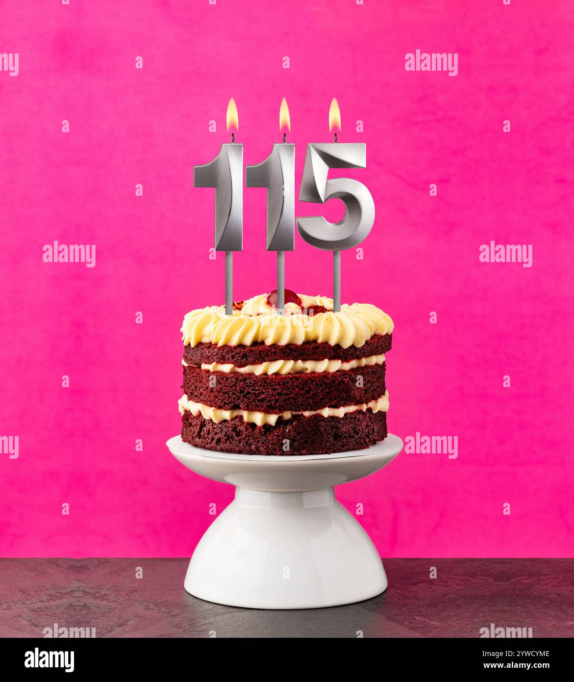 Birthday cake with number 115 candle - Red velvet on a fuchsia ...
