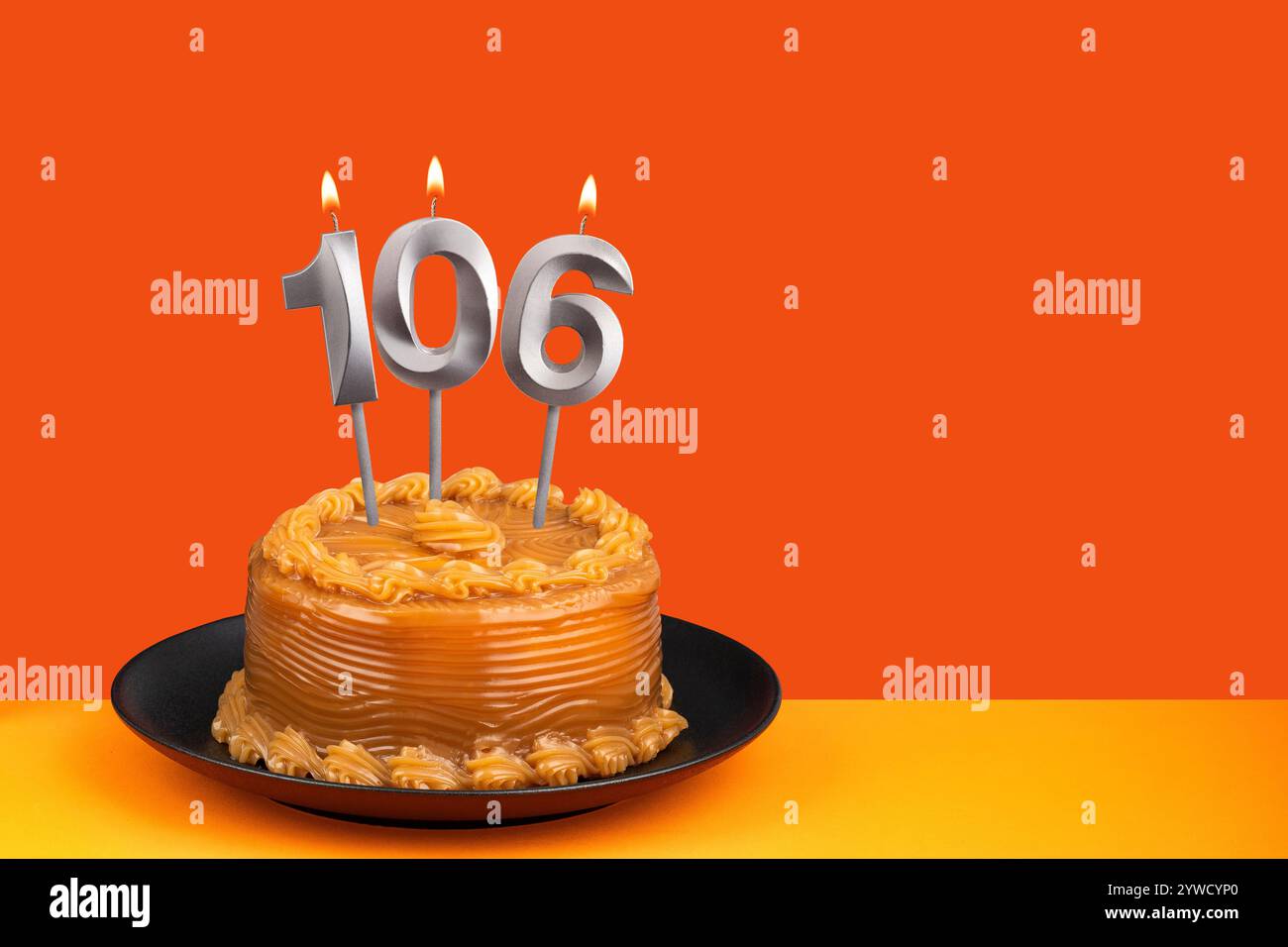 Birthday cake with dulce de leche frosting - Candle number 106 Stock ...