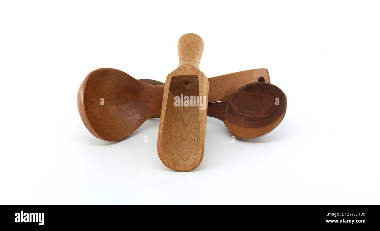 A collection of beautifully crafted wooden kitchen utensils displayed ...