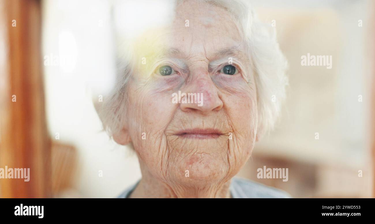 Thinking, window and idea with old woman in living room for memory, reflection and mindfulness ...