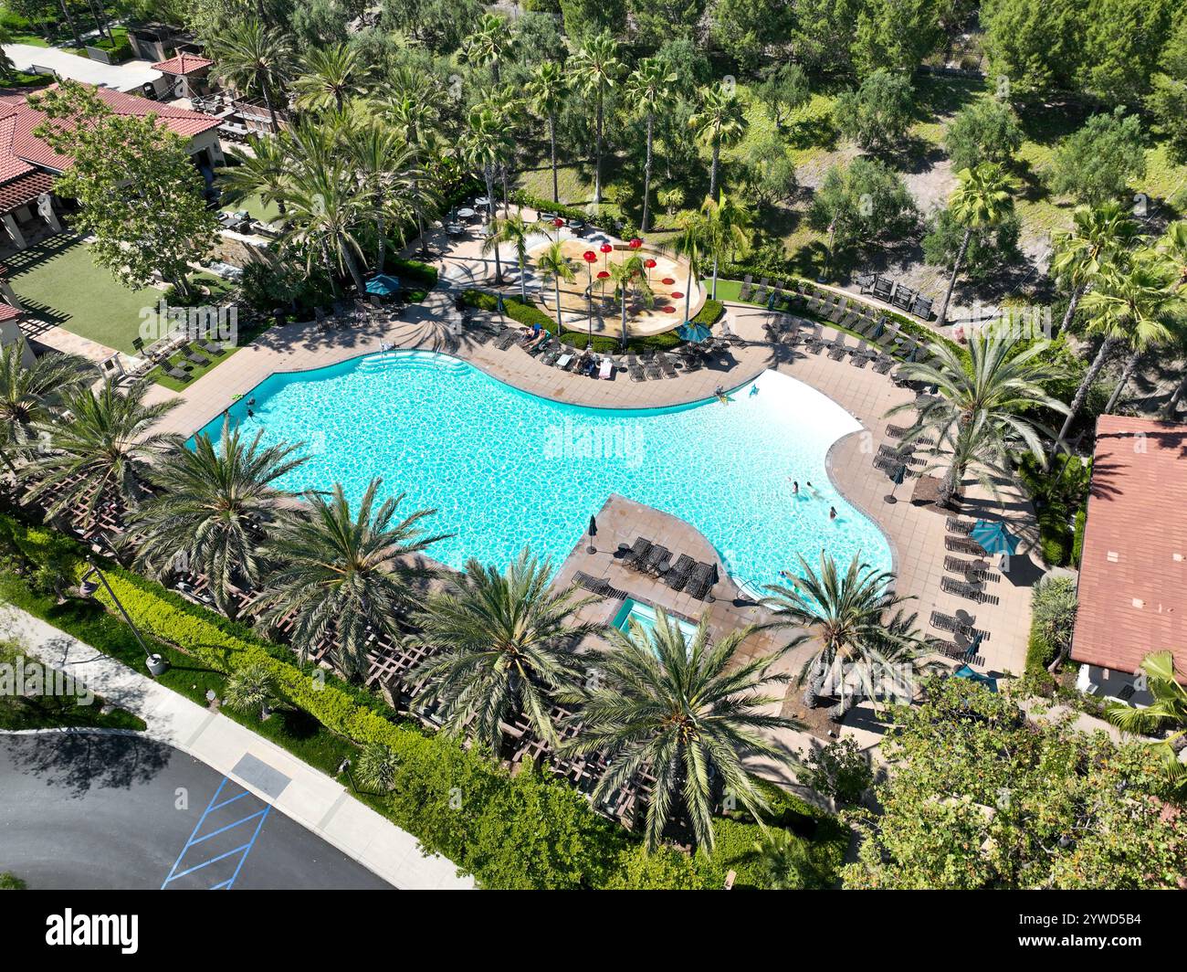 Aerial video of recreational facilities with pool in private ...